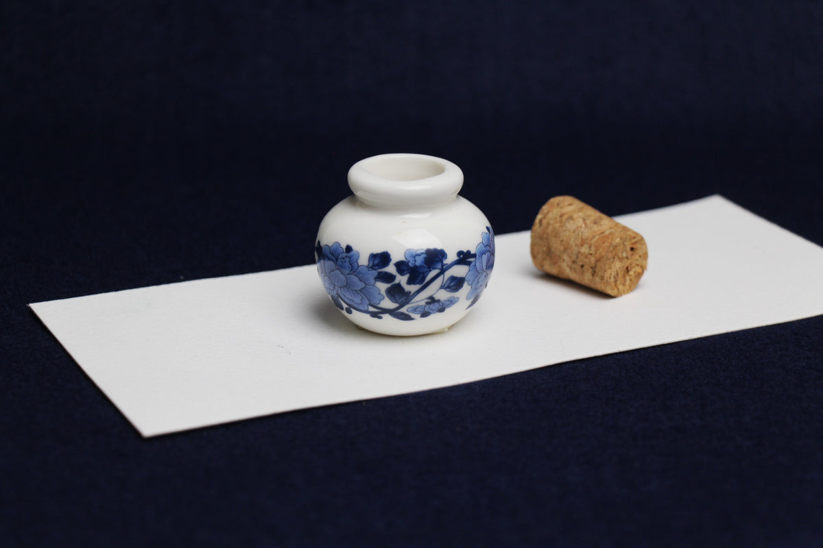 Small, white and blue ceramic inkwell with cork stopper (model 4 ...