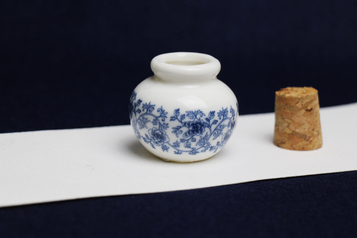 Small, white and blue ceramic inkwell with cork stopper (model 6 ...