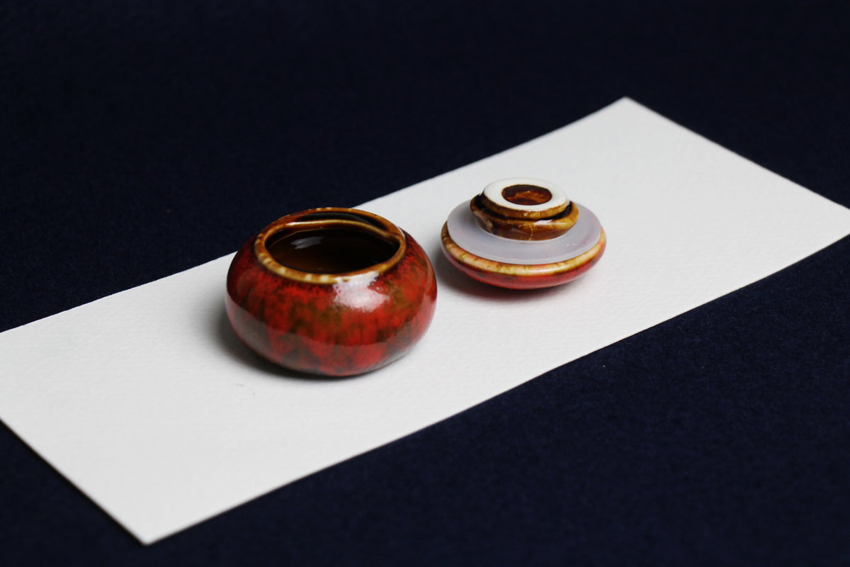 Small ceramic inkwell with twist-and-seal lid: red marble – Arcalliq